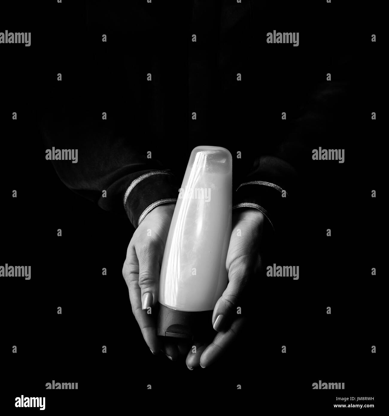 Beauty skincare hand holding Black and White Stock Photos & Images - Alamy