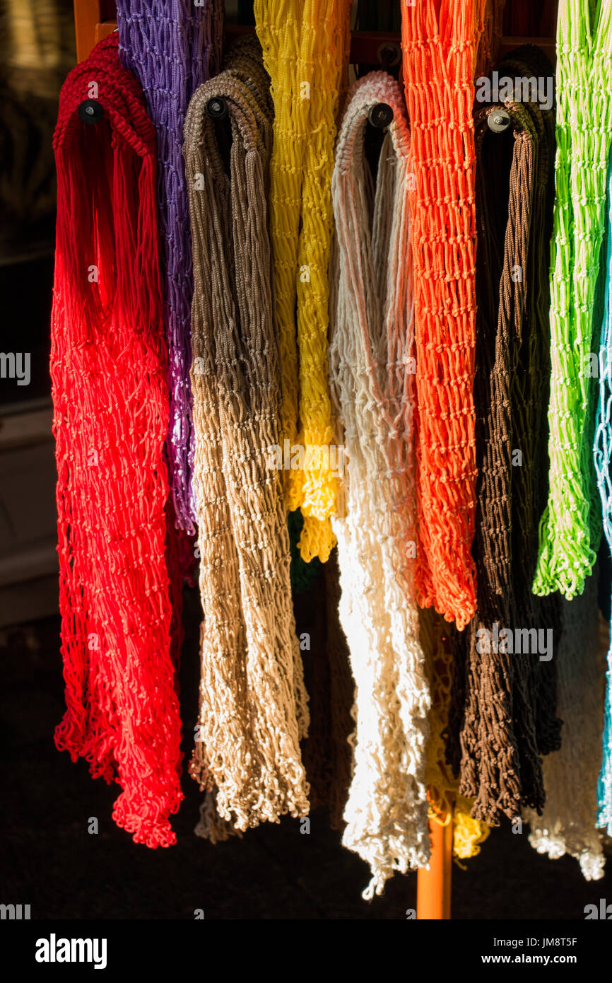 Empty mesh bags of various color at a market place Stock Photo - Alamy