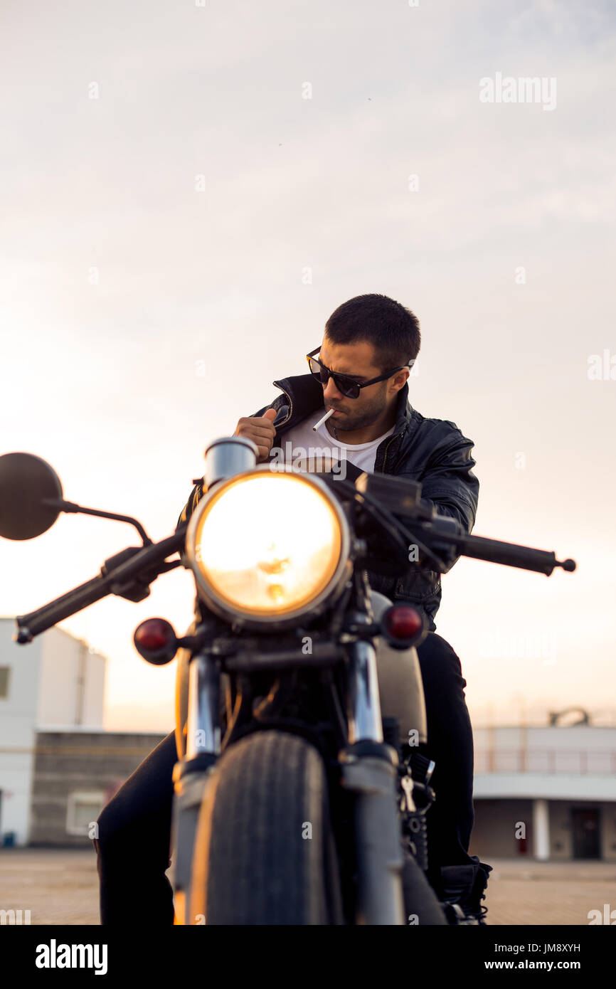 Handsome rider man with beard and mustache in black biker jacket and ...
