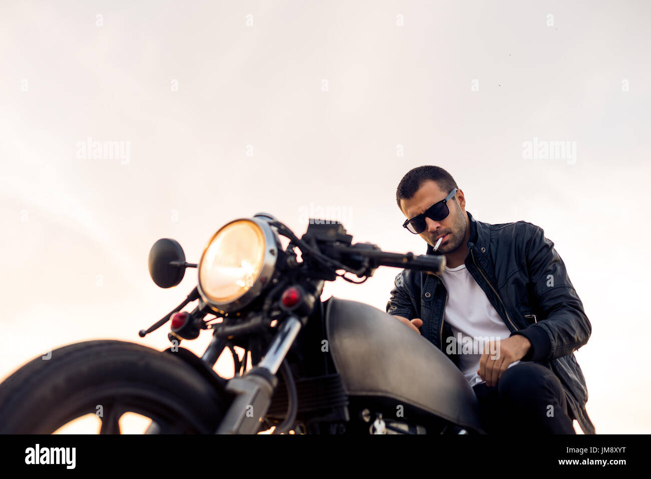 Handsome rider male with beard and mustache in black biker jacket ...