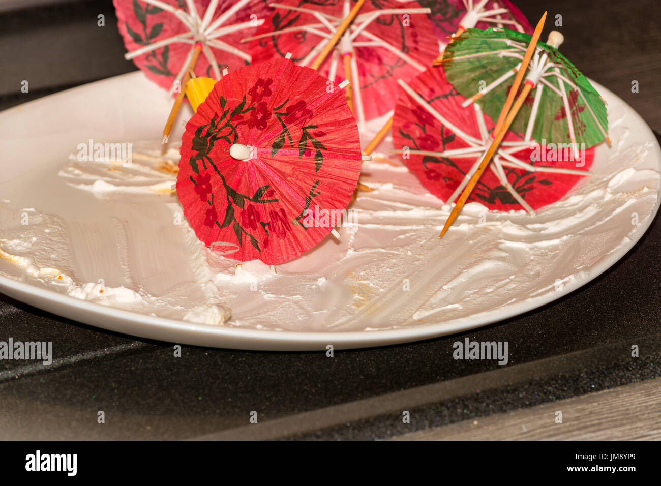 Empty white dessert plate, plate on a kitchen plate with remains of ...