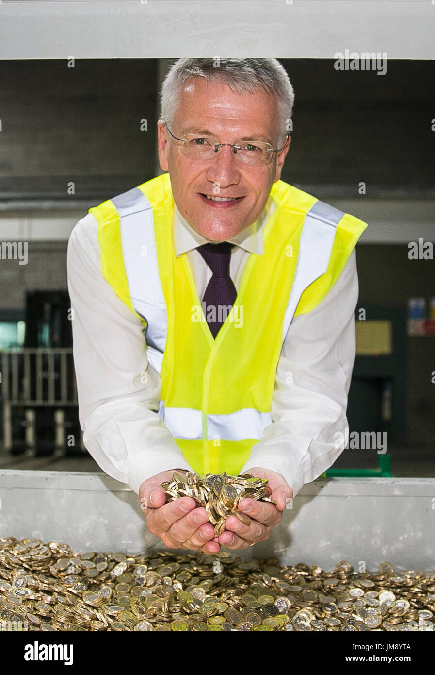 Exchequer Secretary to the Treasury, Andrew Jones MP, holding new one ...