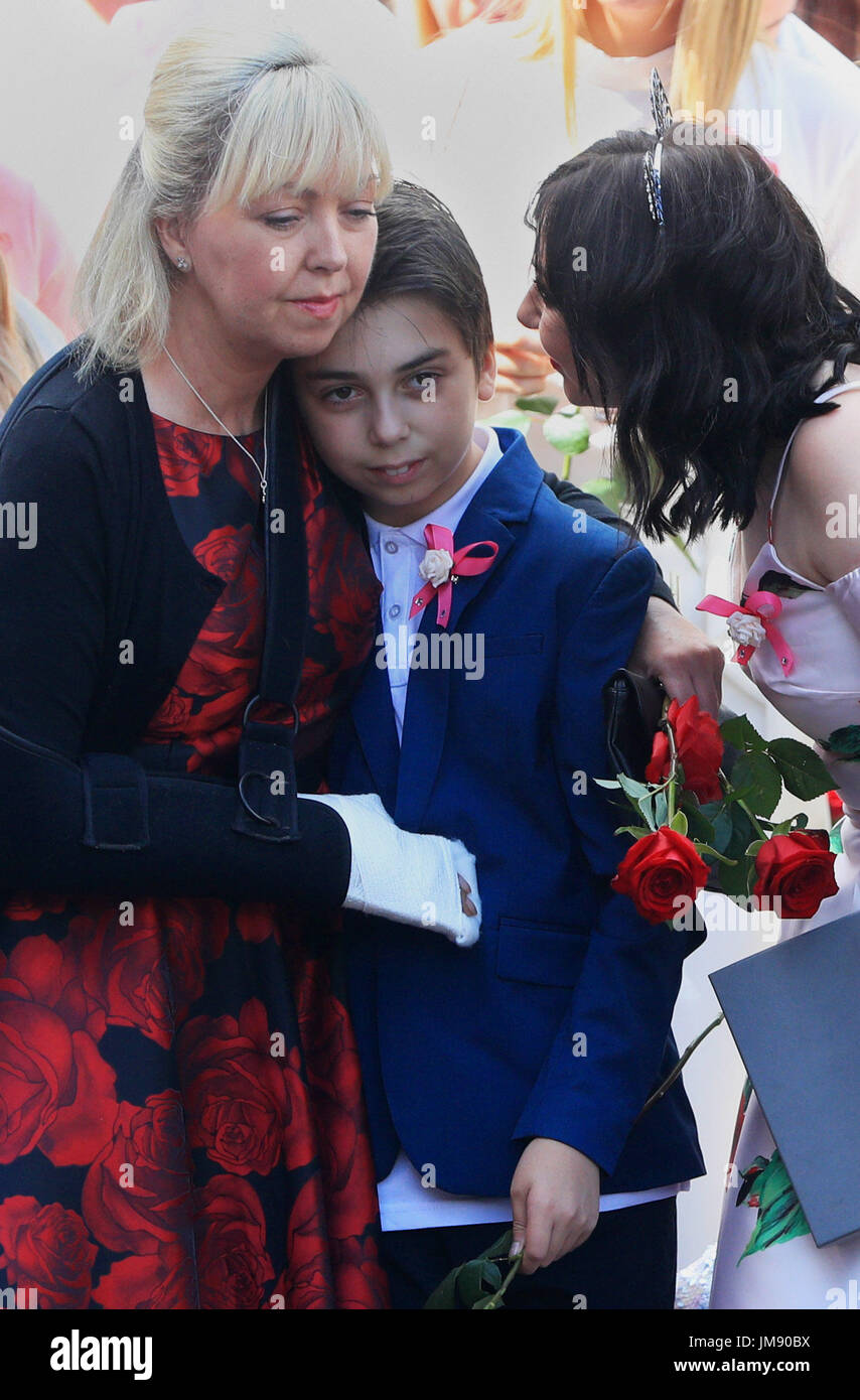 Mum Lisa Roussos and brother Xander look on as the coffin of Saffie ...