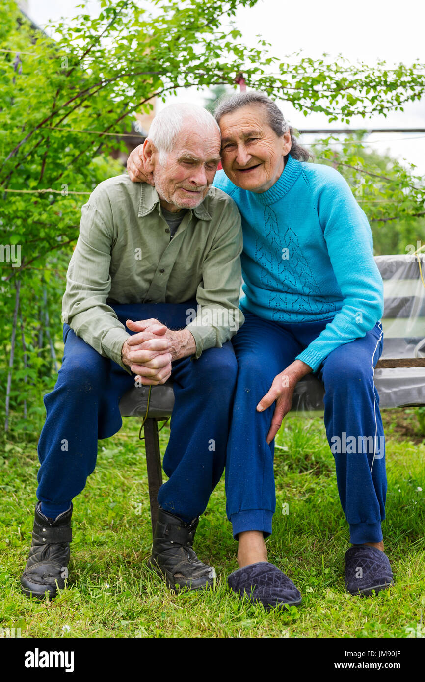 Cute 80 plus year old married couple posing for a portrait in their ...