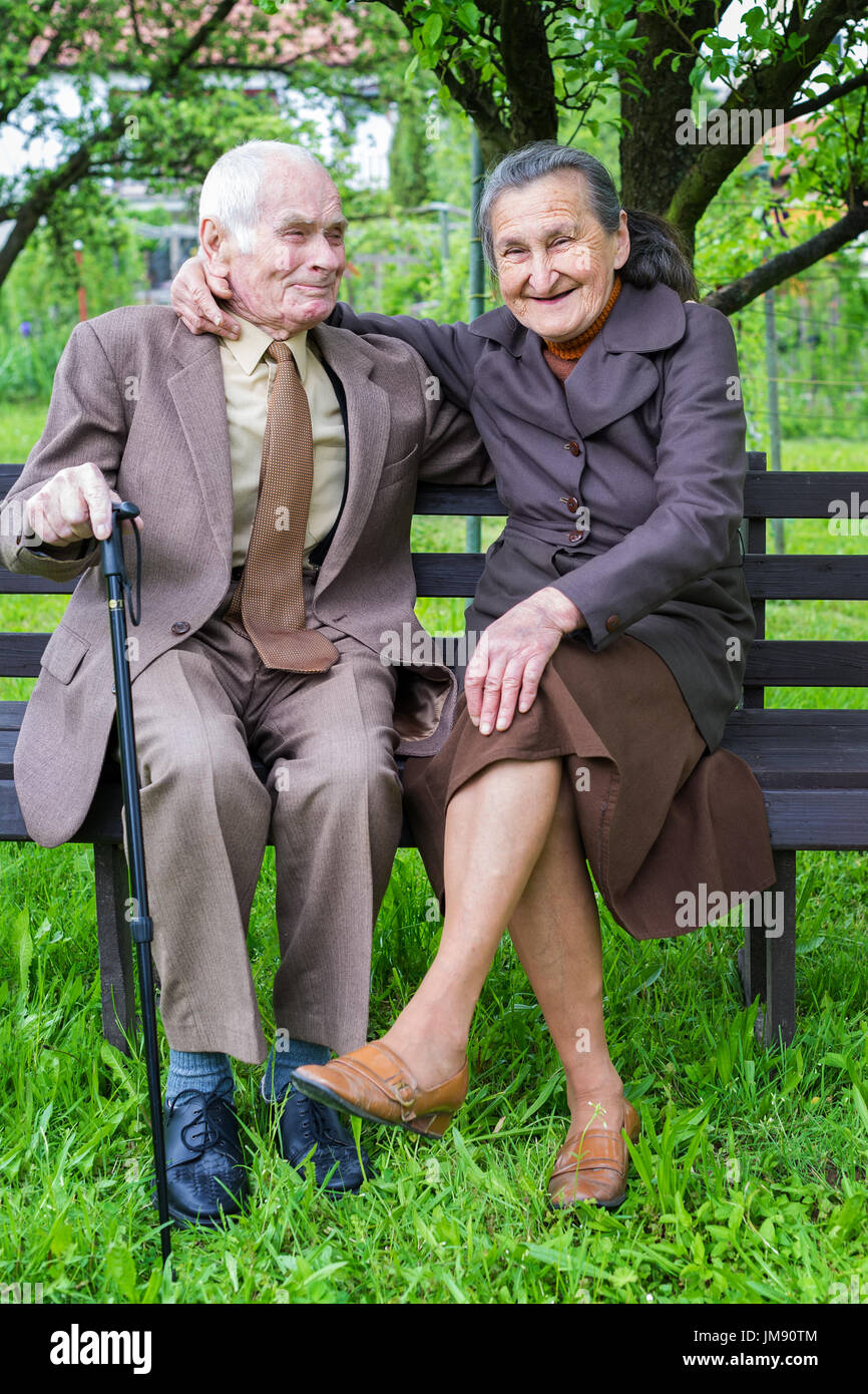 Cute 80 plus year old married couple posing for a portrait in their ...