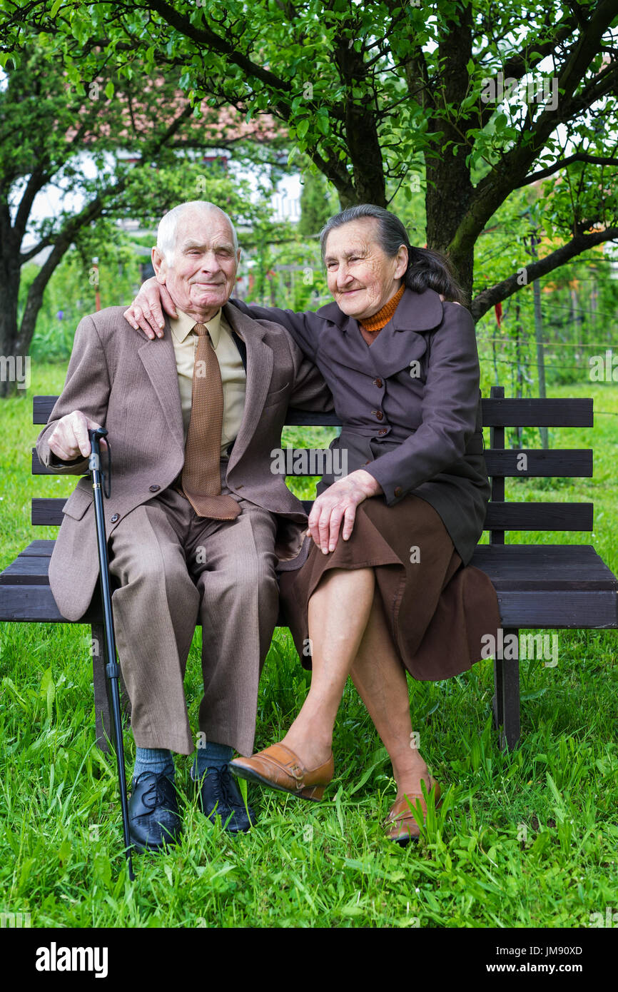 Cute 80 plus year old married couple posing for a portrait in their ...