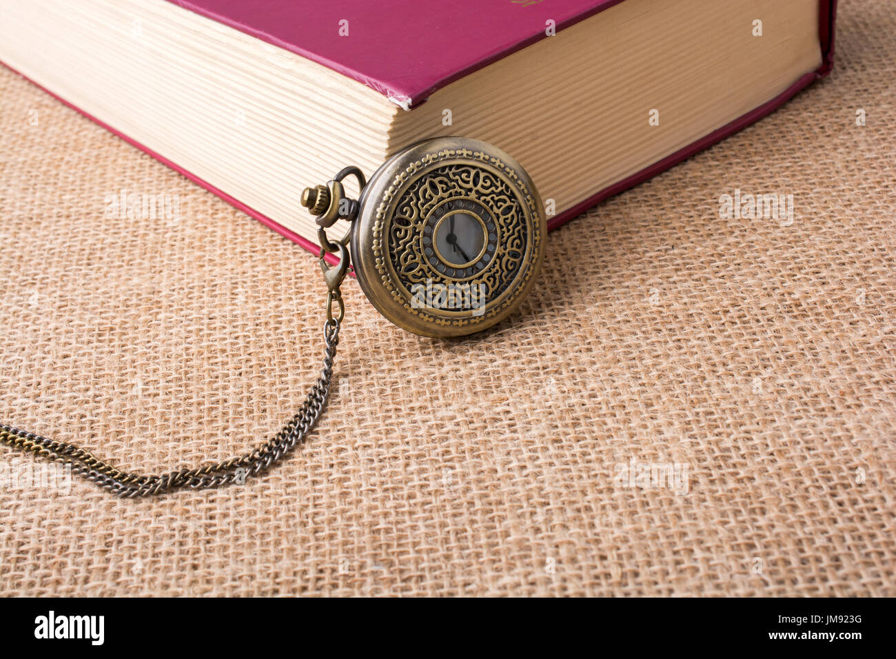 Pocket watch book stack hi-res stock photography and images - Alamy