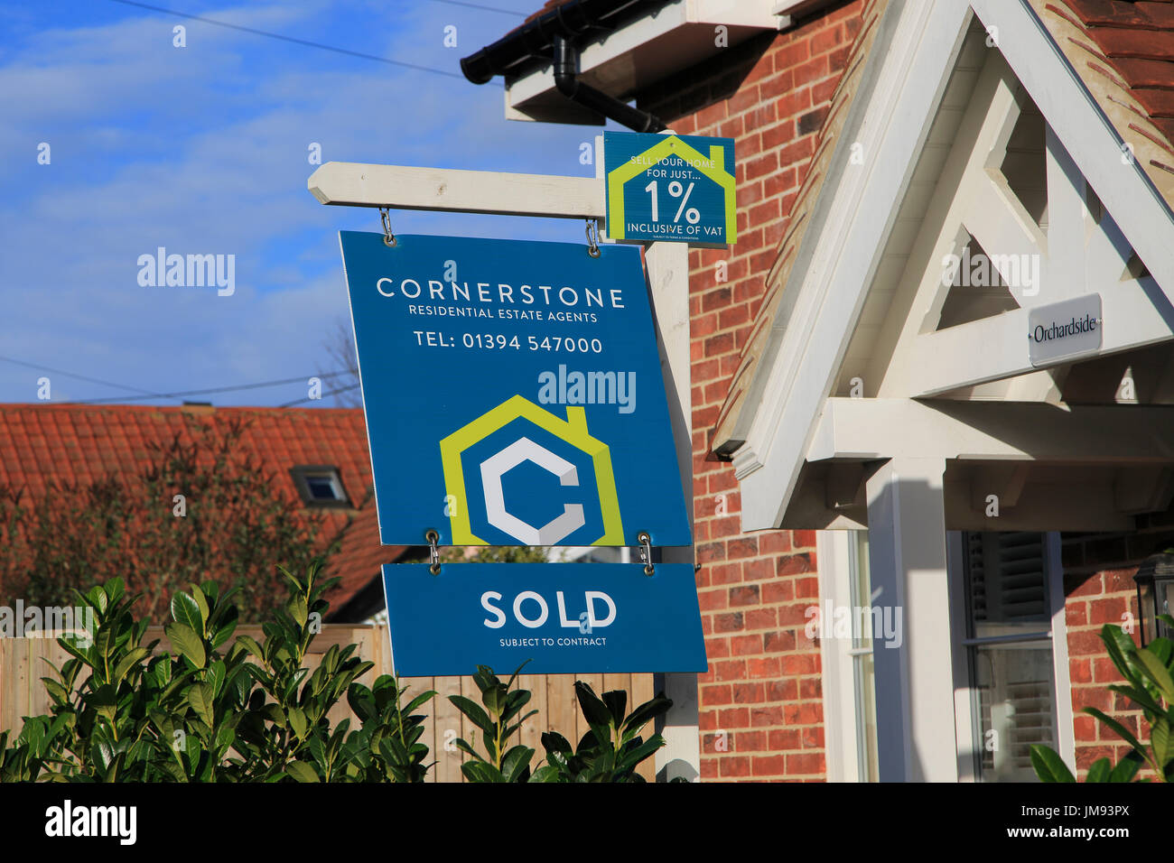 Estate agent sold sign outside modern house, Melton, Suffolk, England ...