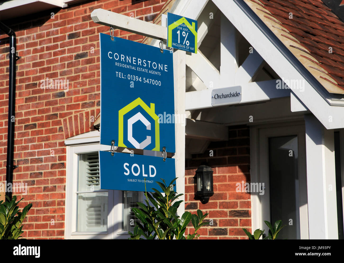 Estate agent sold sign outside modern house, Melton, Suffolk, England ...