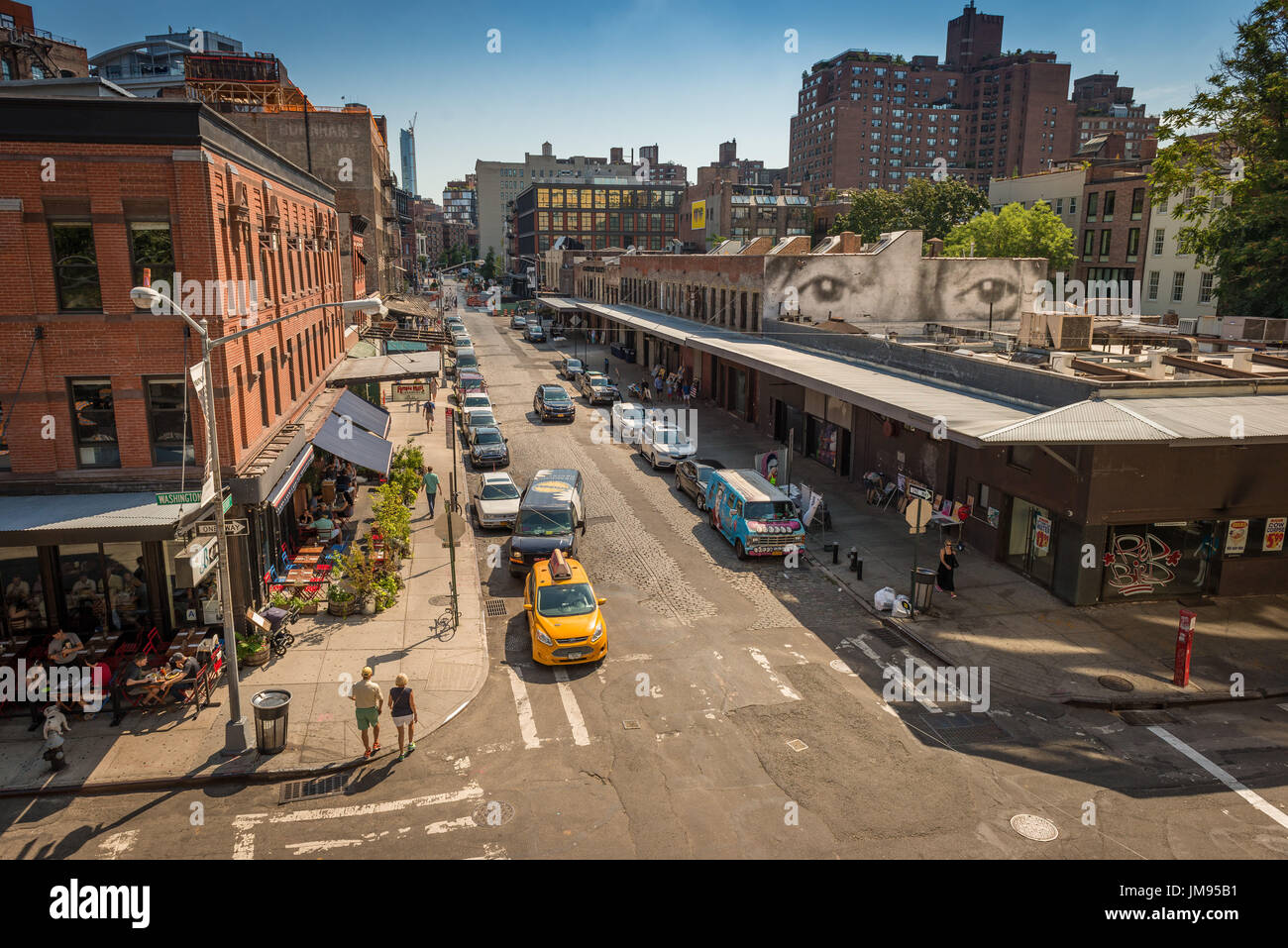 City street view from New York's Highline pedestrian walkway in Lower ...