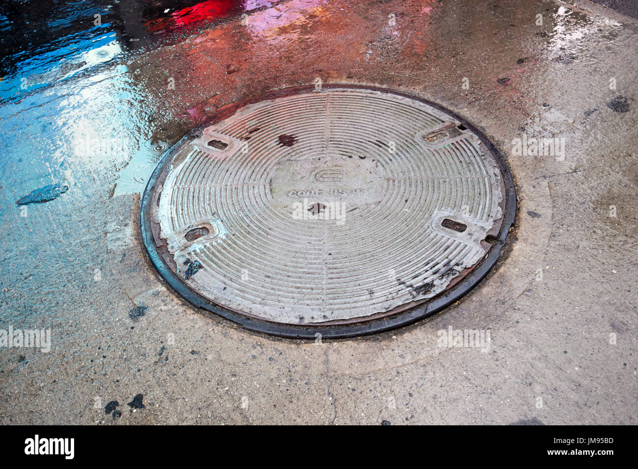 conedison manhole cover in the rain New York City USA Stock Photo - Alamy