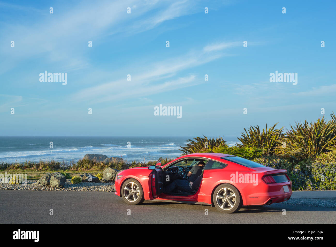Red sports car on beach hi-res stock photography and images - Alamy