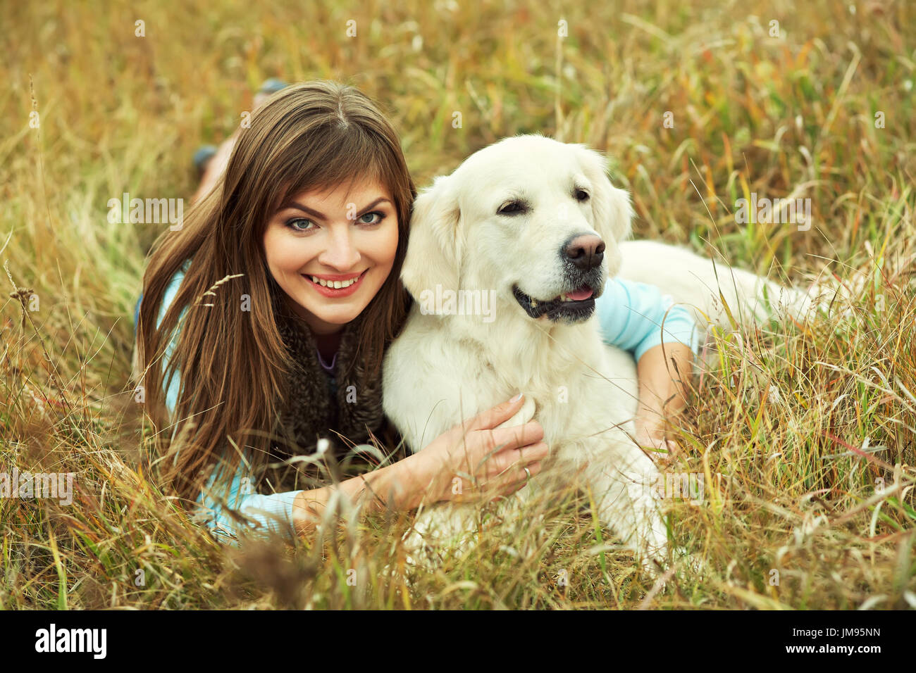 Labrador retriever with owner Stock Photo - Alamy