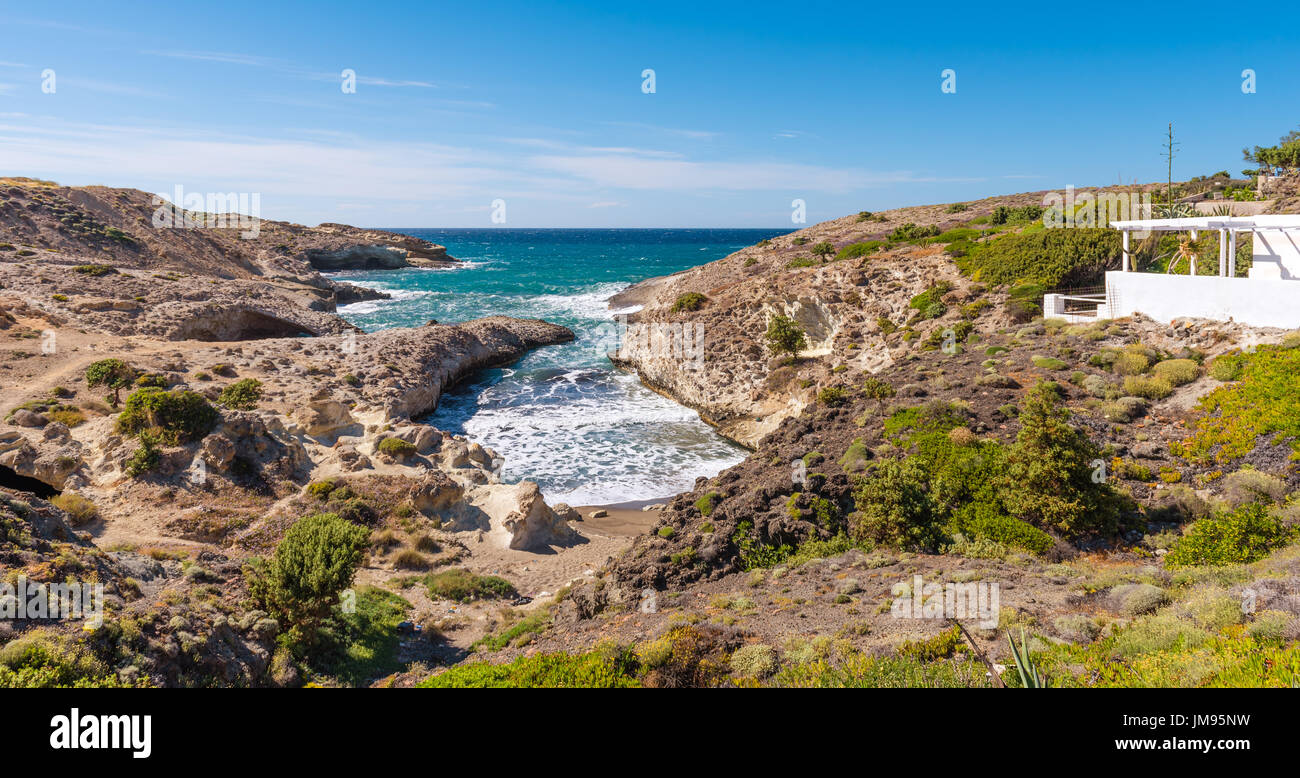 Kapros, small bay between rocks and blue sea on Milos island. Cyclades ...