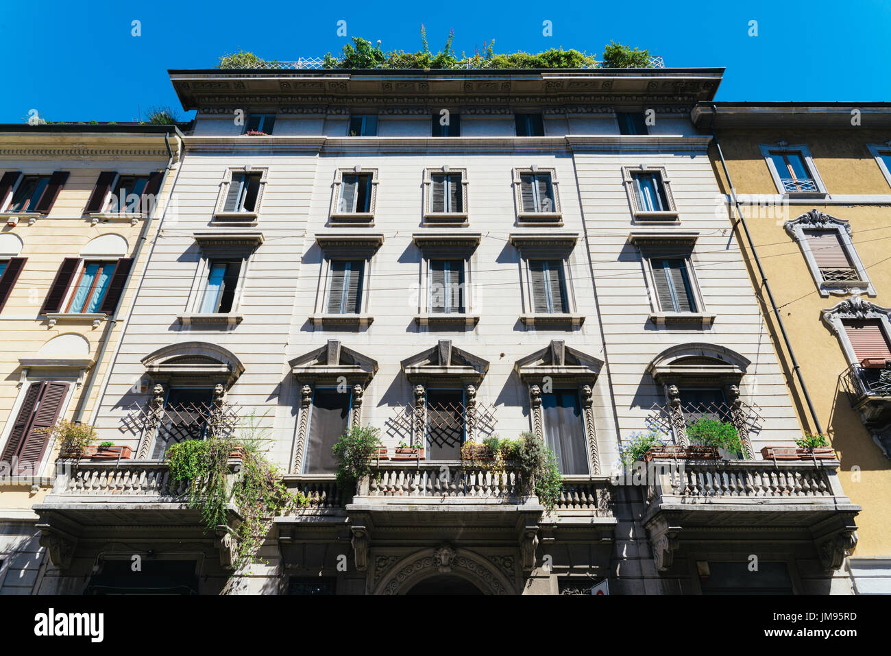 Milan, Italy architecture in the summer with beautiful terraces full of ...