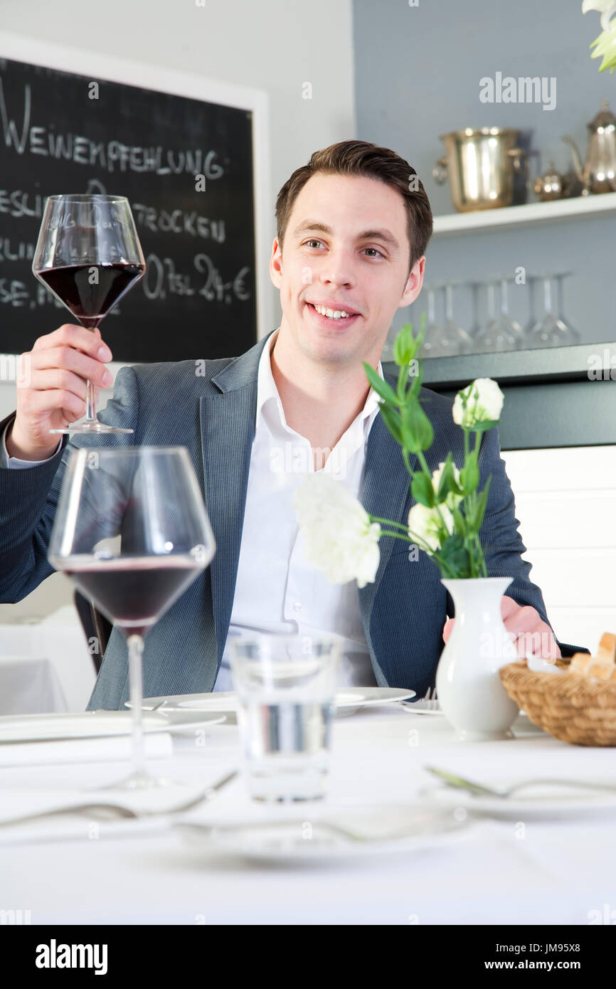 Raise a glass of red wine hi-res stock photography and images - Alamy