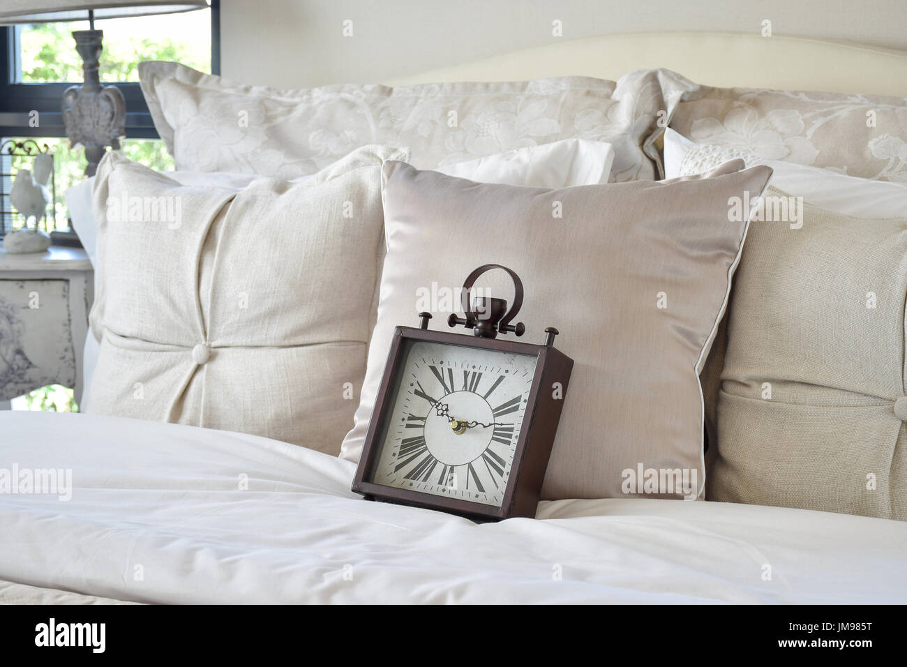 luxury bedroom interior with classic style alarm clock on bed Stock ...