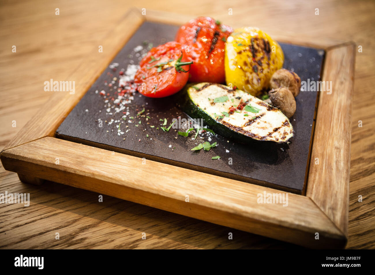 Grilled vegetables on a stone board Stock Photo - Alamy