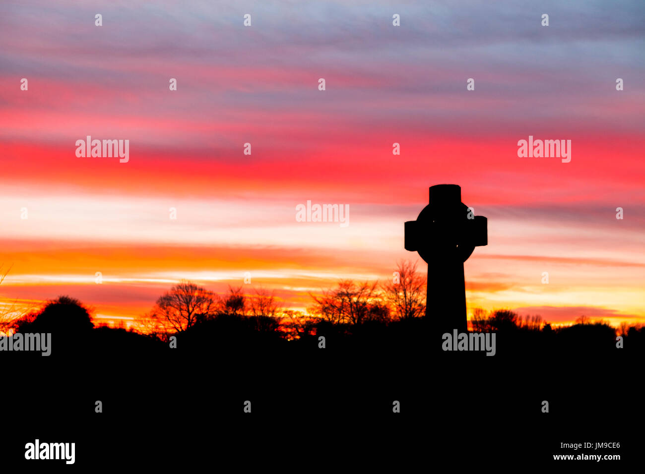 Durham landscape: iconic stone Celtic cross standing in the graveyard ...