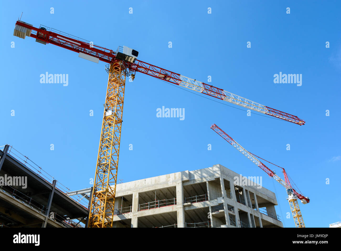 Two yellow jib cranes hi-res stock photography and images - Alamy