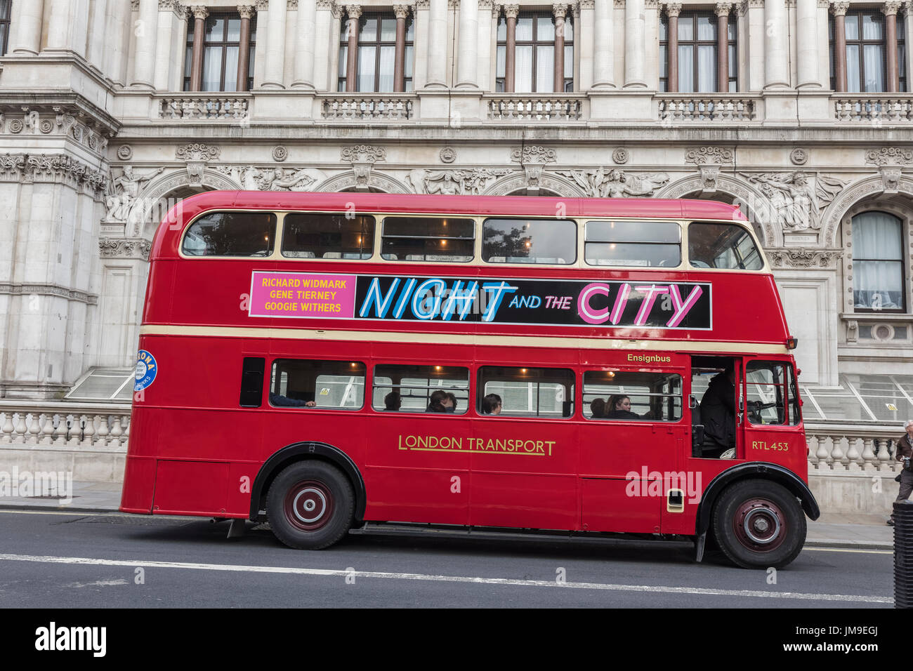 London Vintage Red Bus in The Strand Stock Photo - Alamy