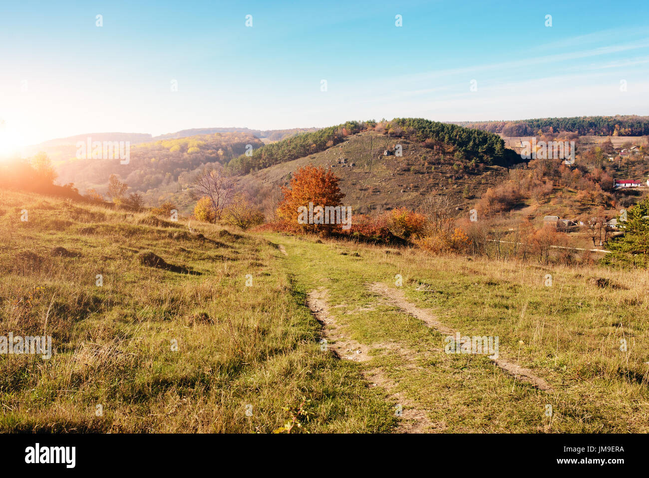 View on the beautiful colorful autumn landscape of the hills with trees ...