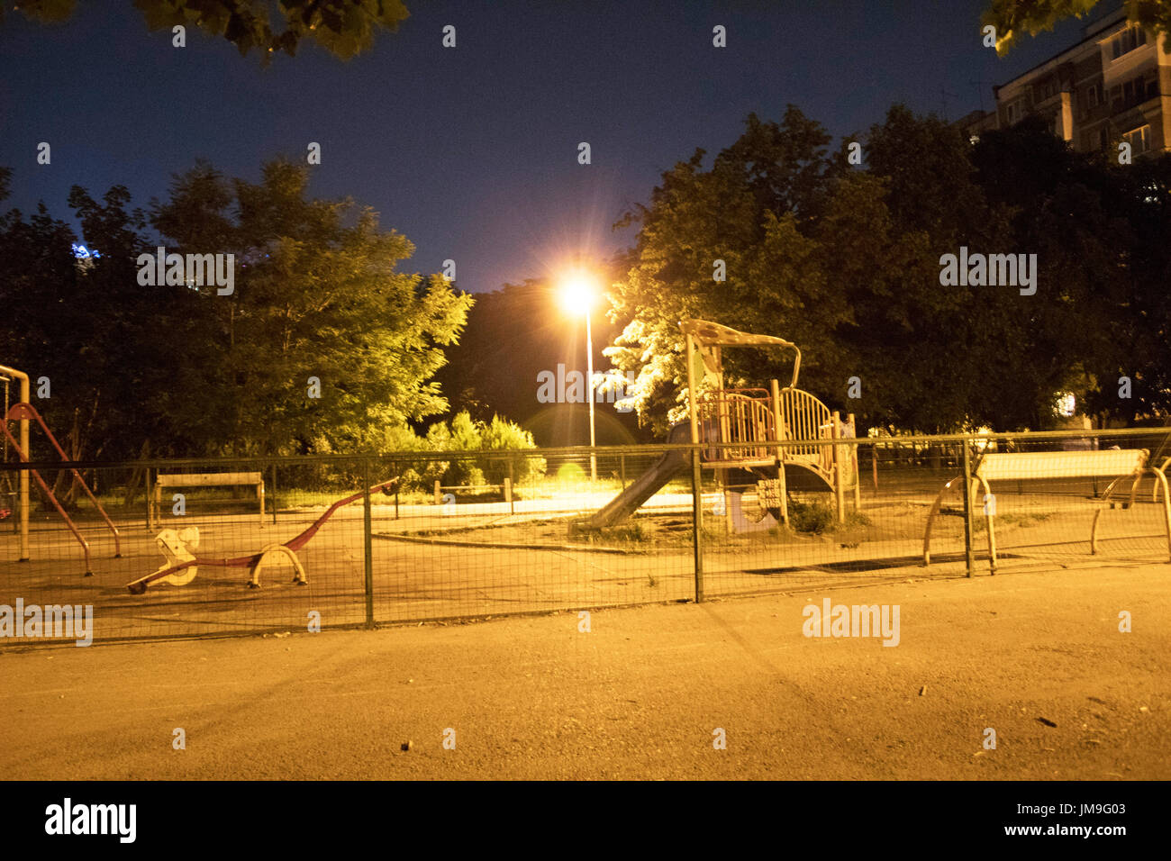 Playground in the night Stock Photo - Alamy