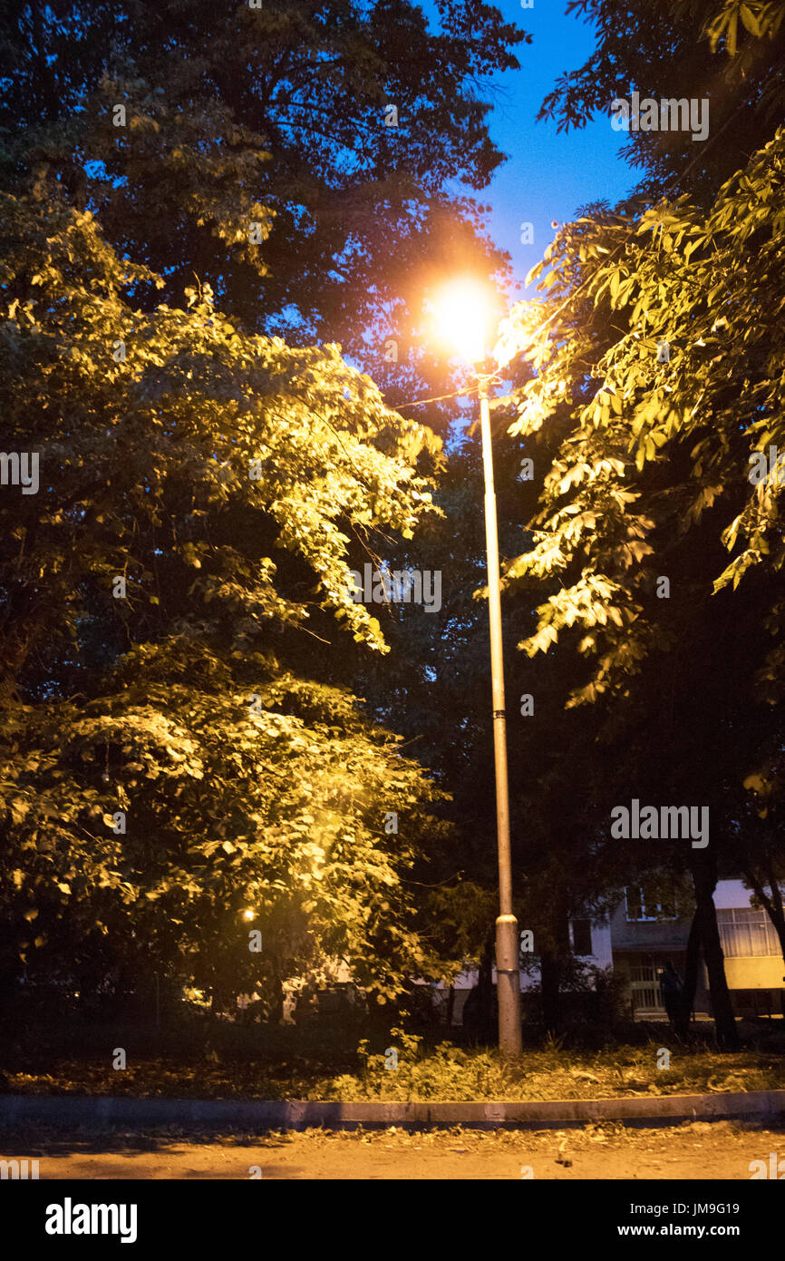 Lamp post near a playground Stock Photo - Alamy