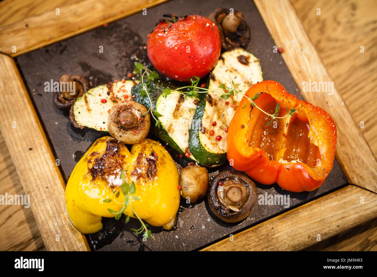 Grilled vegetables on a stone board Stock Photo - Alamy