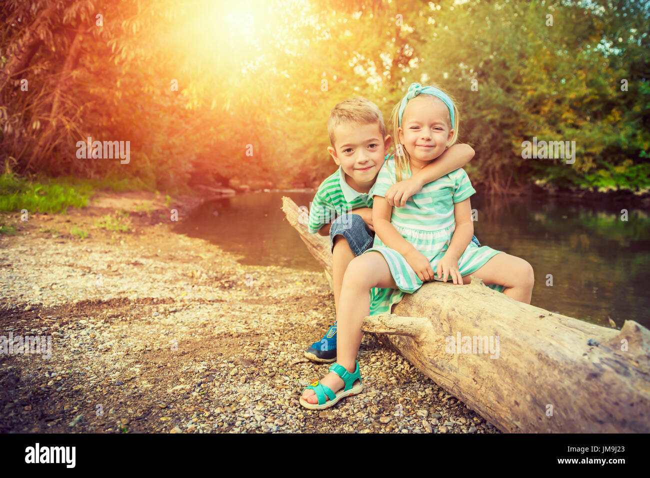 Adorable siblings posing for a portrait, summer outdoors concept Stock ...