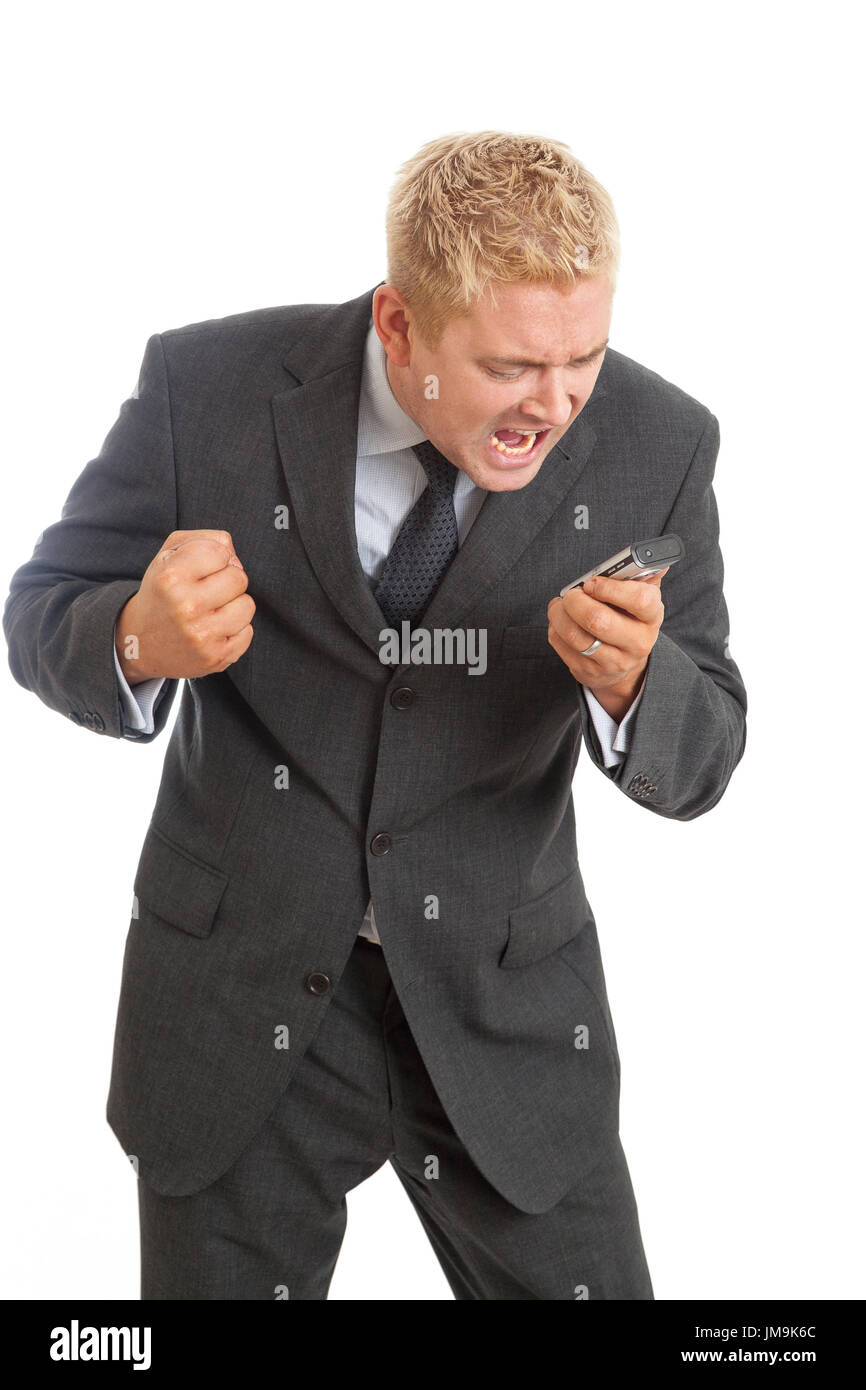 Angry young adult man in suit shouting at mobile phone and clenched ...