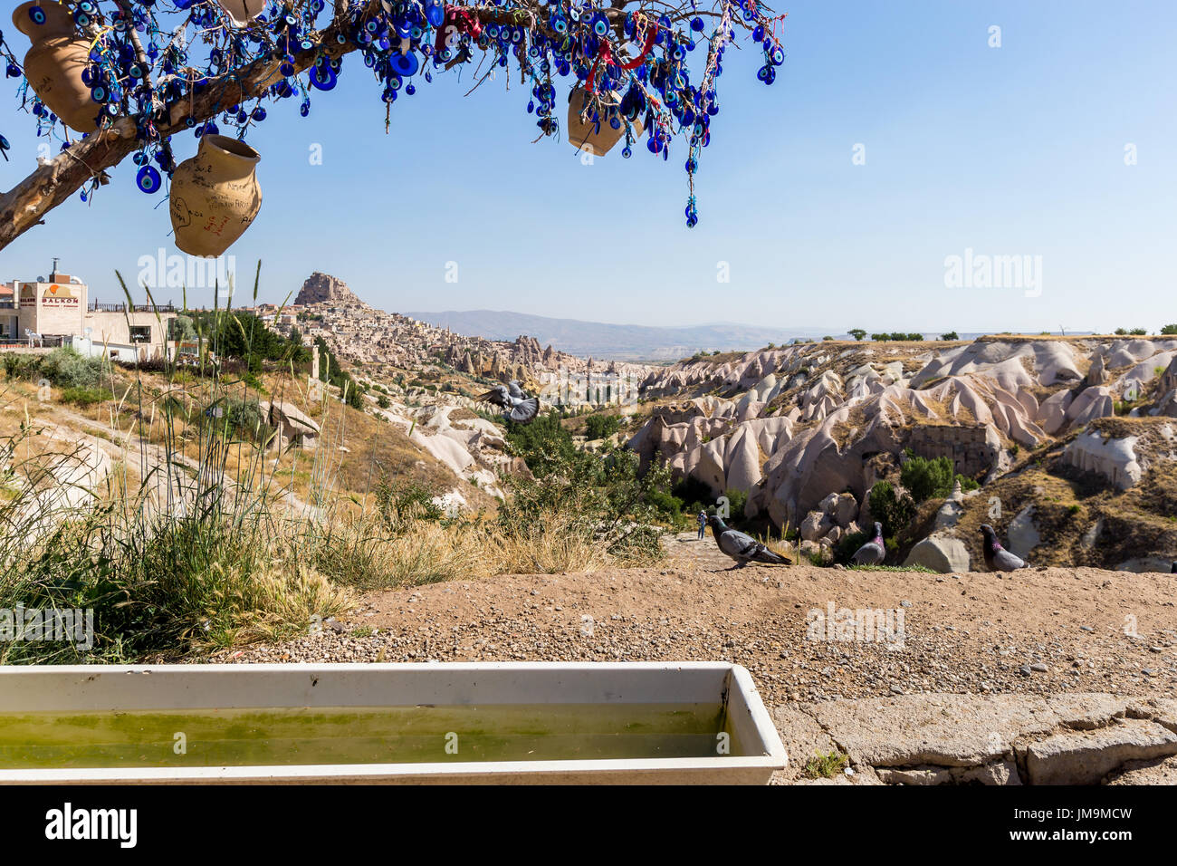Guvercinlik Valley and Fairy tale chimneys on background of blue sky in ...