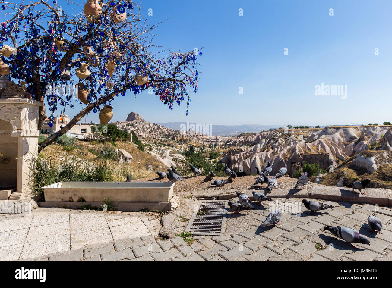 Guvercinlik Valley and Fairy tale chimneys on background of blue sky in ...