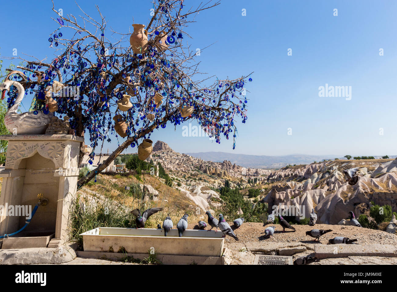 Guvercinlik Valley and Fairy tale chimneys on background of blue sky in ...