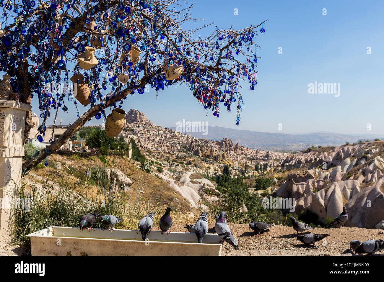 Guvercinlik Valley and Fairy tale chimneys on background of blue sky in ...