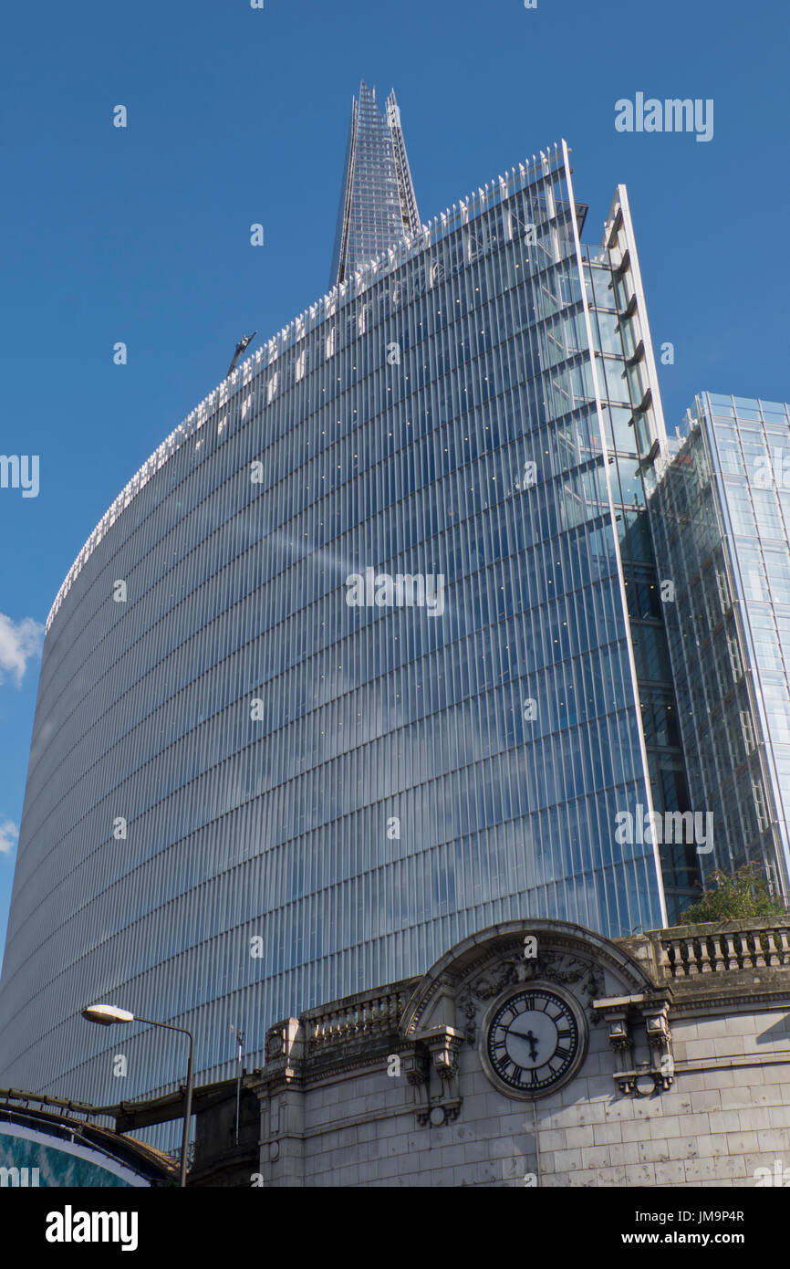 Old railway arches and building with Shard skyscraper in background ...