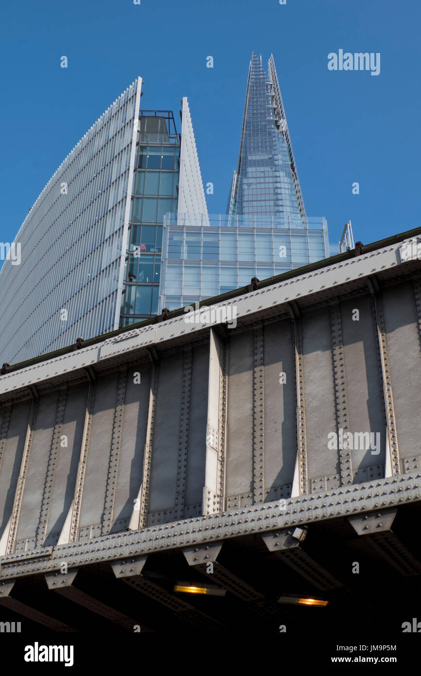 Old railway arches and building with Shard skyscraper in background ...