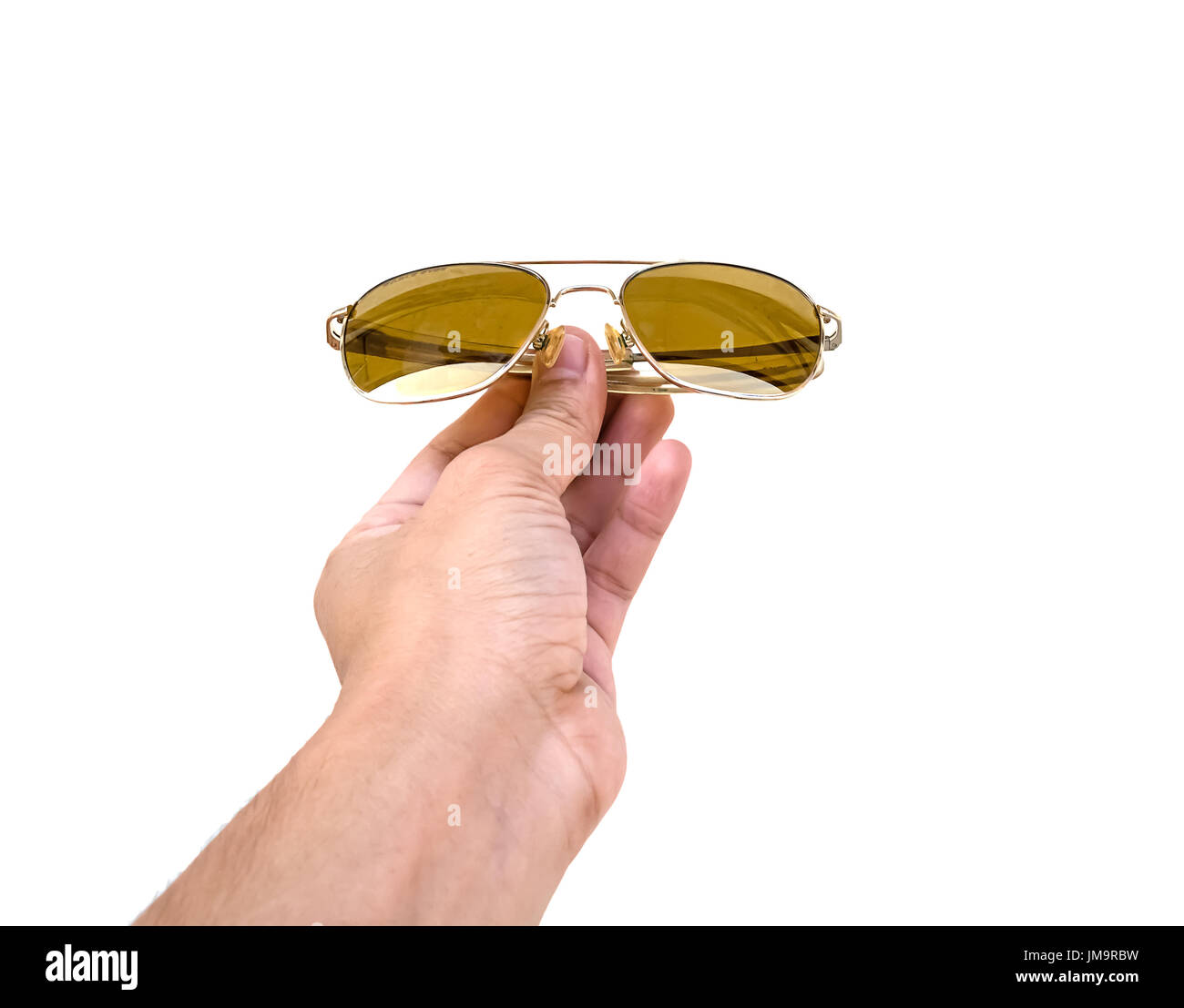 Men's hand holding sun glassest. Isolated on white background with copy ...