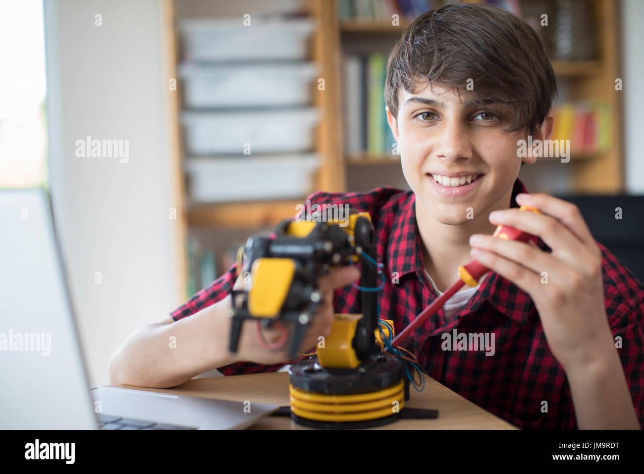 Portrait Of Teenage Boy Building Robotic Arm At School Stock Photo - Alamy