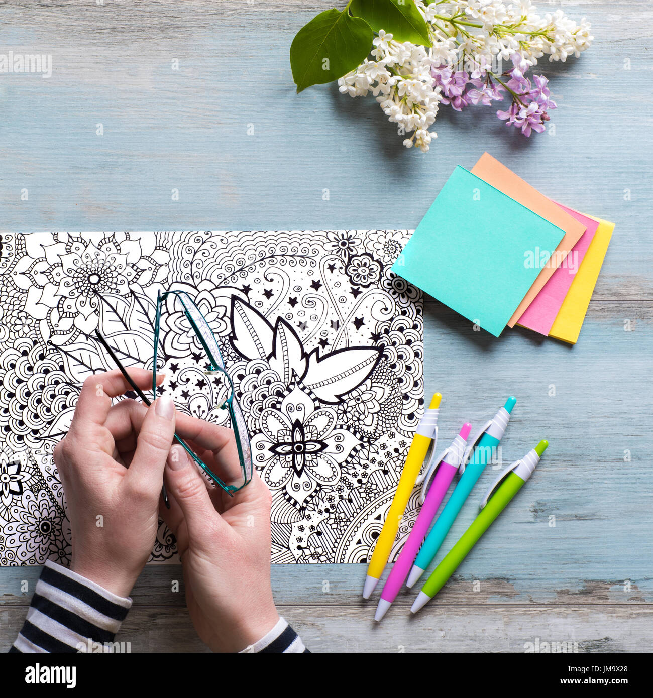 Flat lay, female colouring adult colouring books, new stress relieving ...