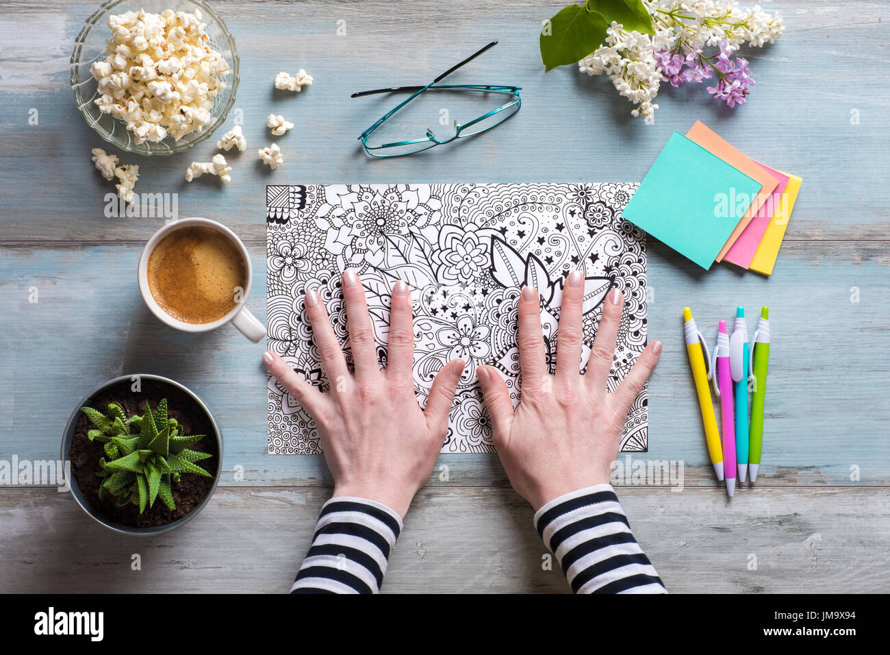 Flat lay, female colouring adult colouring books, new stress relieving ...