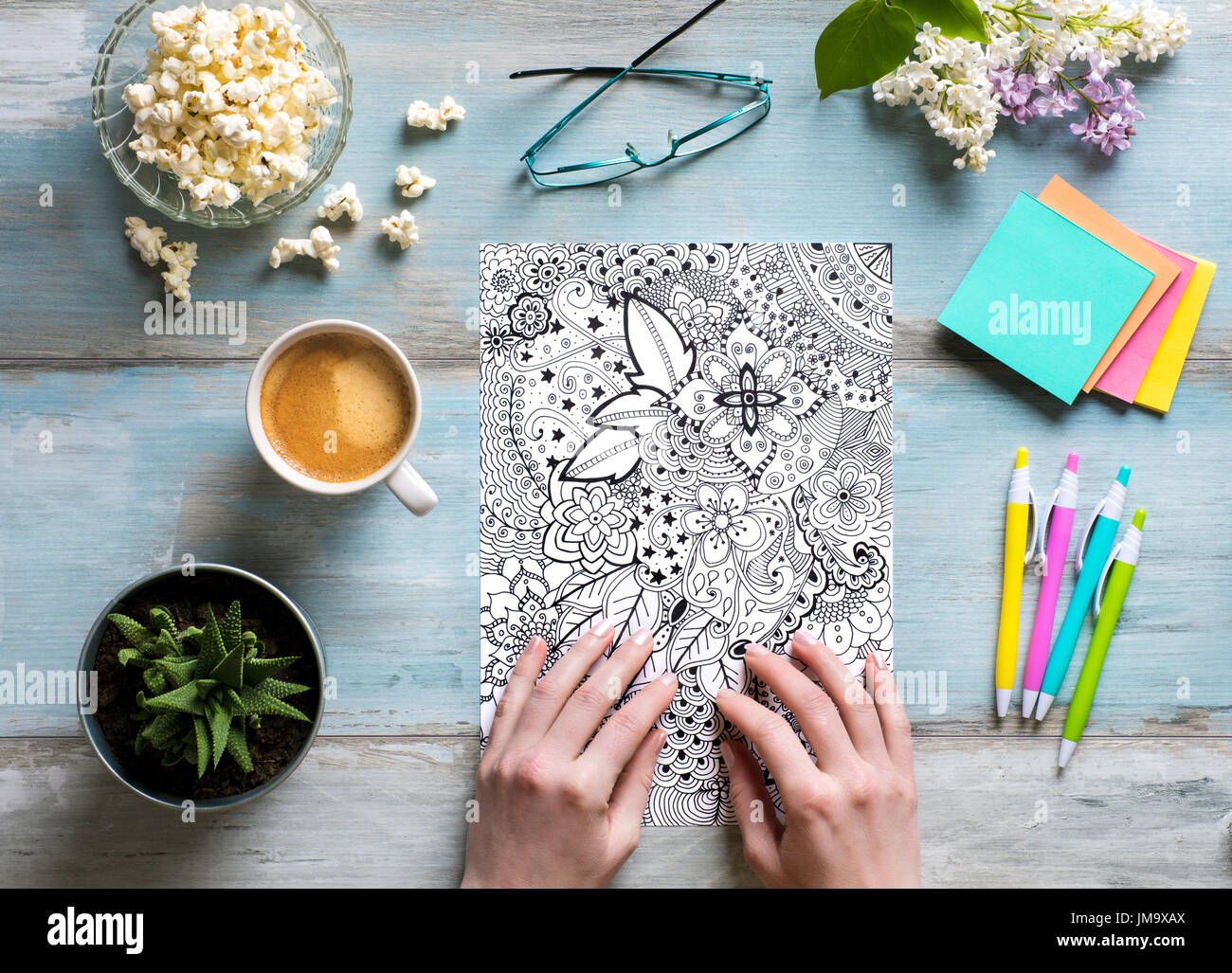 Flat lay, female colouring adult colouring books, new stress relieving ...