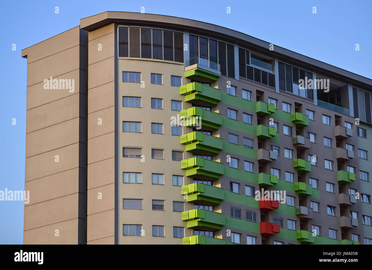 New modern building with many green balconies Stock Photo - Alamy