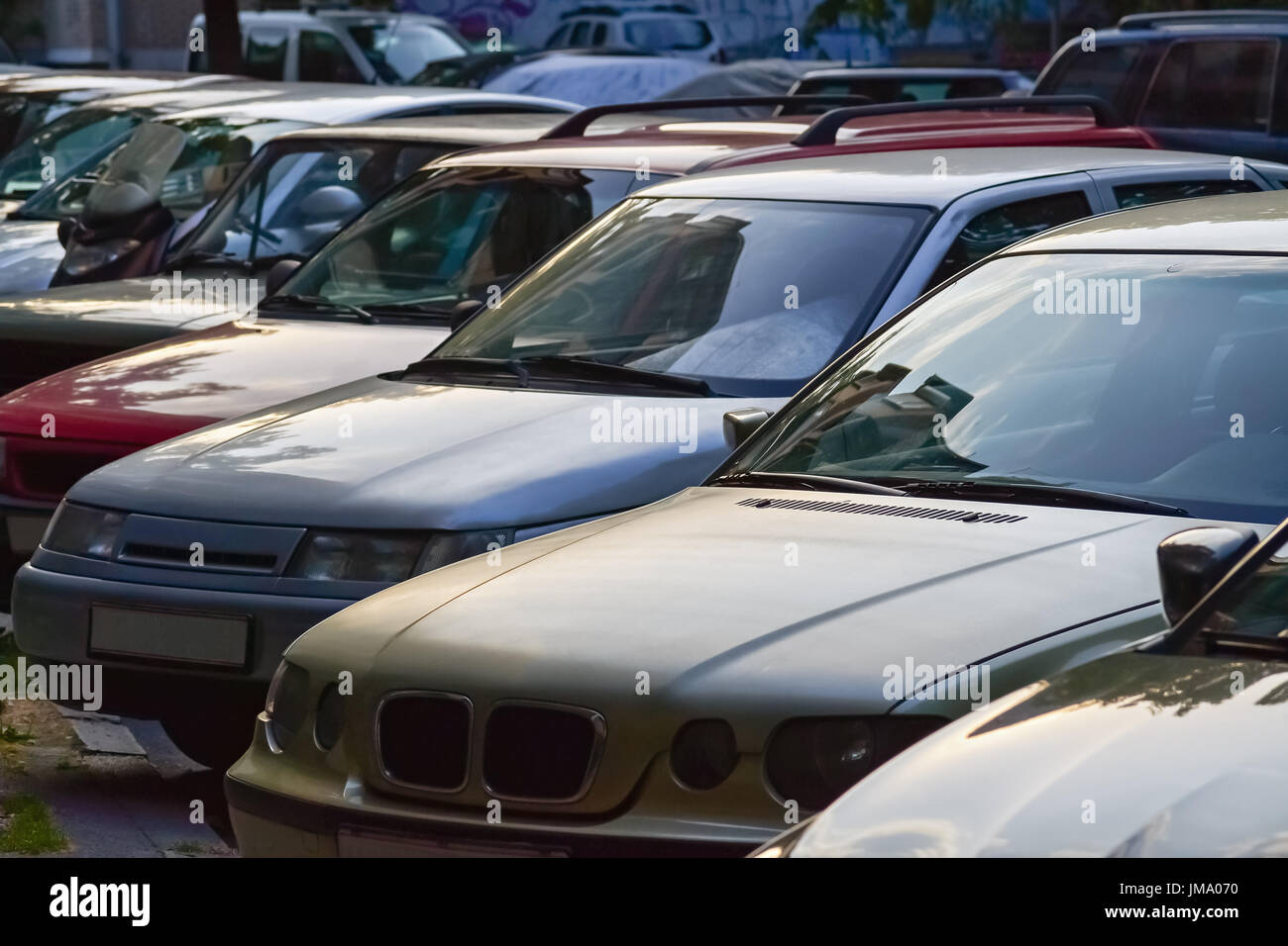 Mess of many parked cars on the street Stock Photo - Alamy