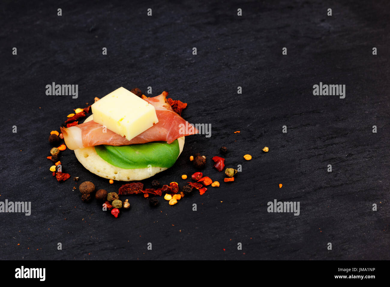 Homemade pancake canapes on slate stone plate for finger food party ...