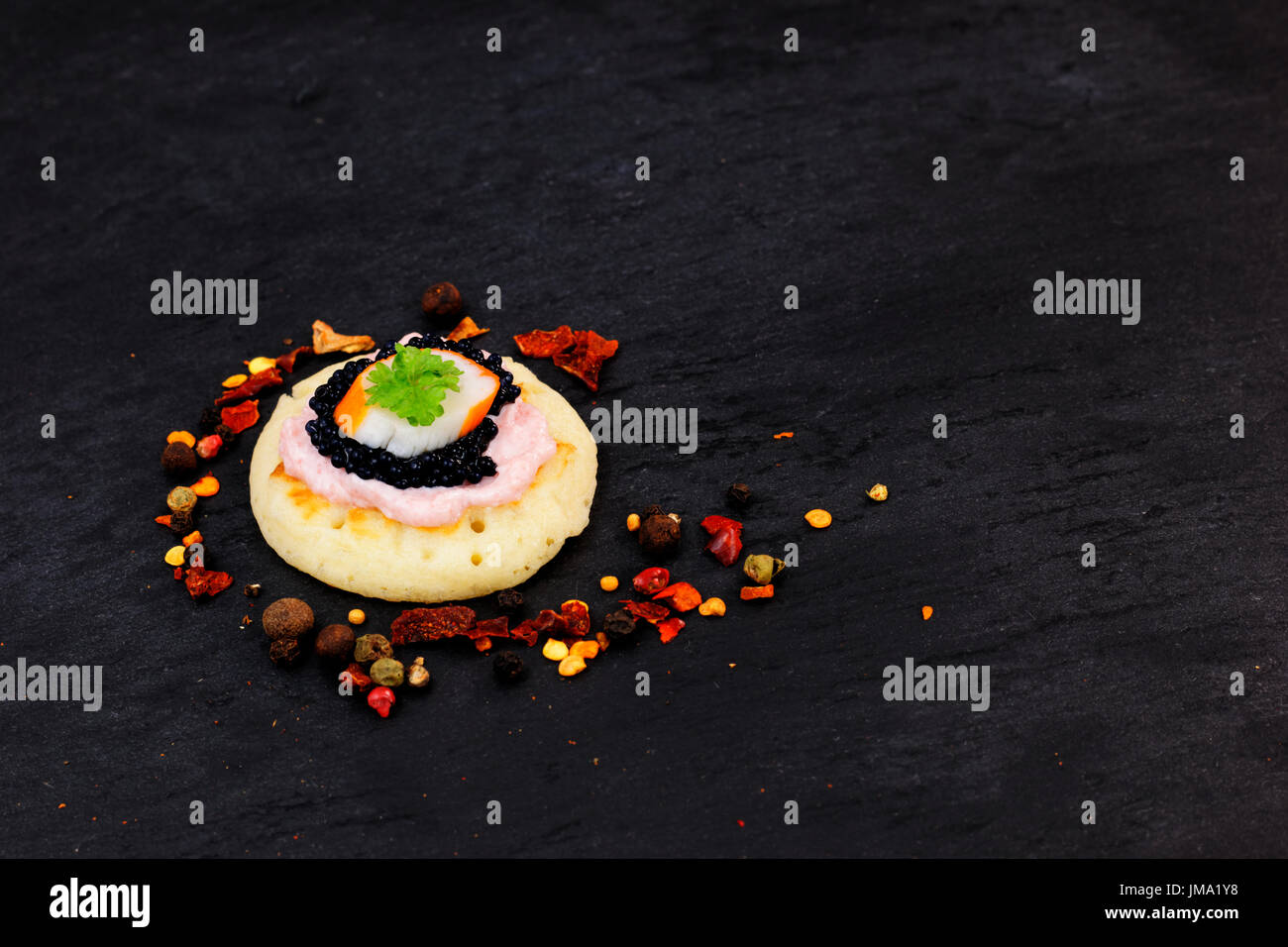 Homemade pancake canapes on slate stone plate for finger food party ...