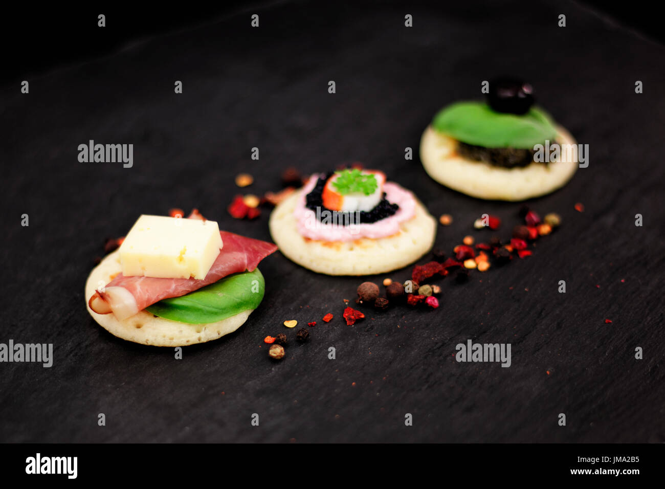 Homemade pancake canapes on slate stone plate for finger food party ...