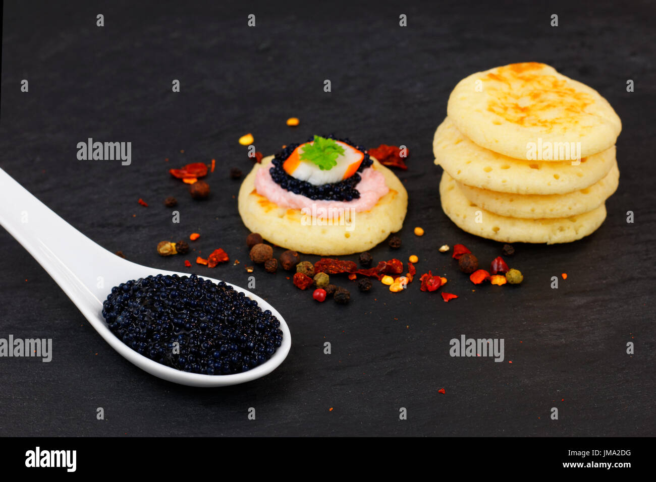 Homemade pancake canapes on slate stone plate for finger food party ...