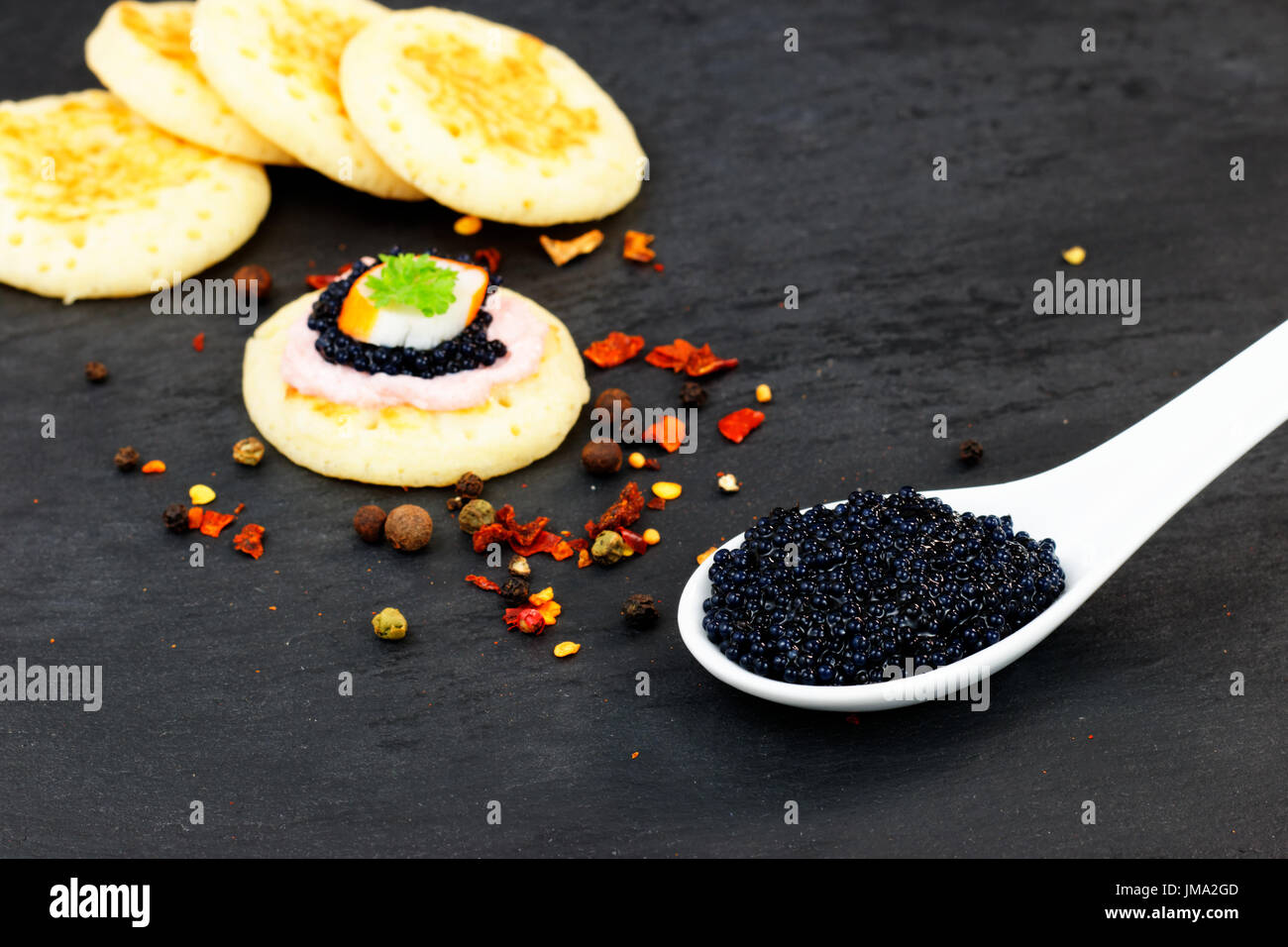 Homemade pancake canapes on slate stone plate for finger food party ...