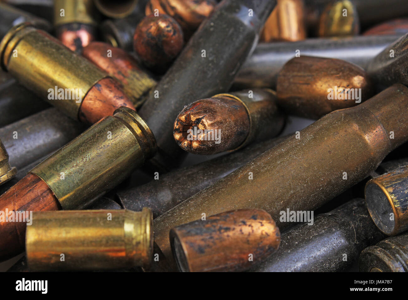 Heap of gun bullets. Weapon Cartridge case sleeve background texture, 7 ...